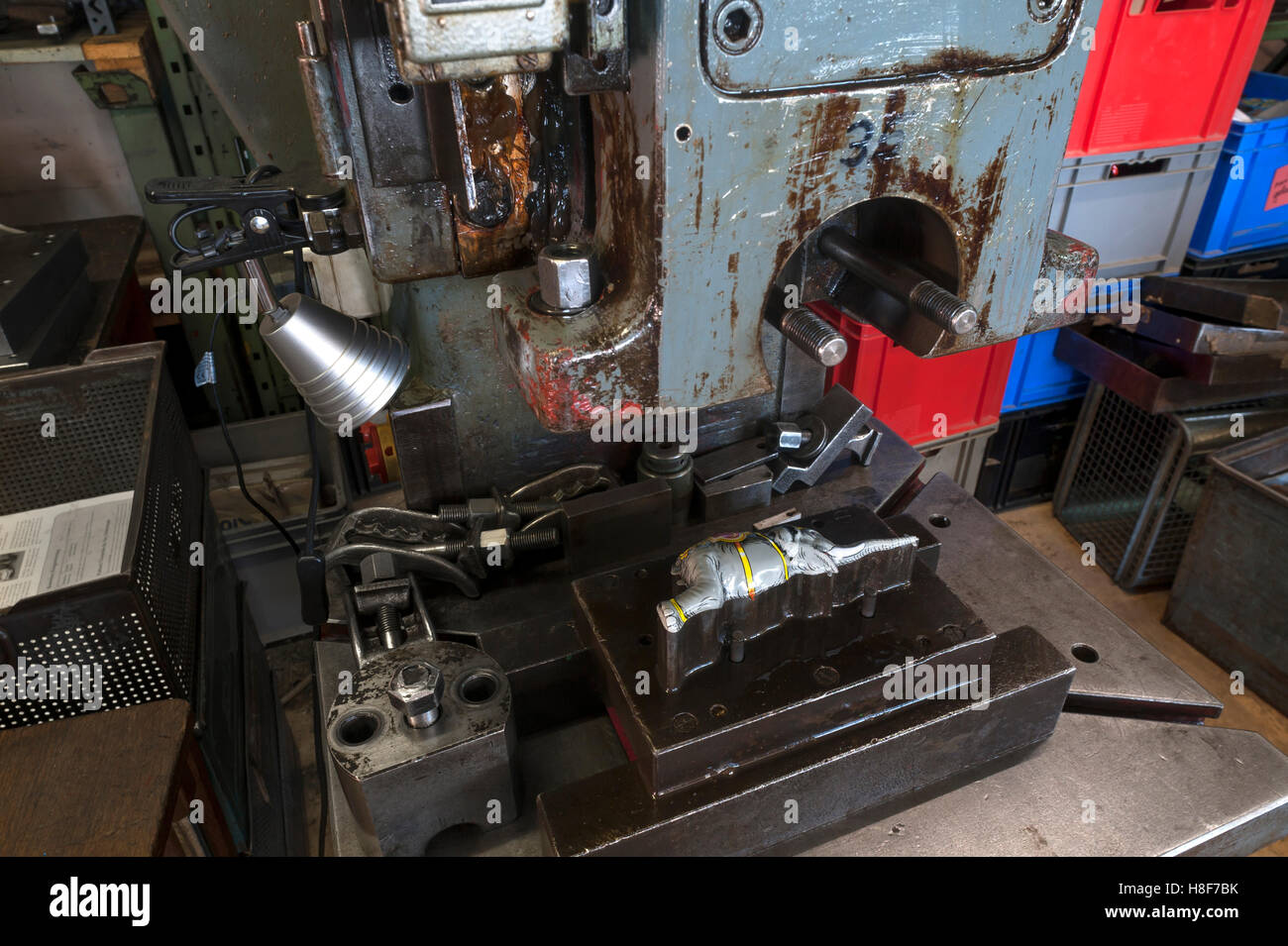 Squeezing machine from the 1950s with mold and ready pressed elephants ...