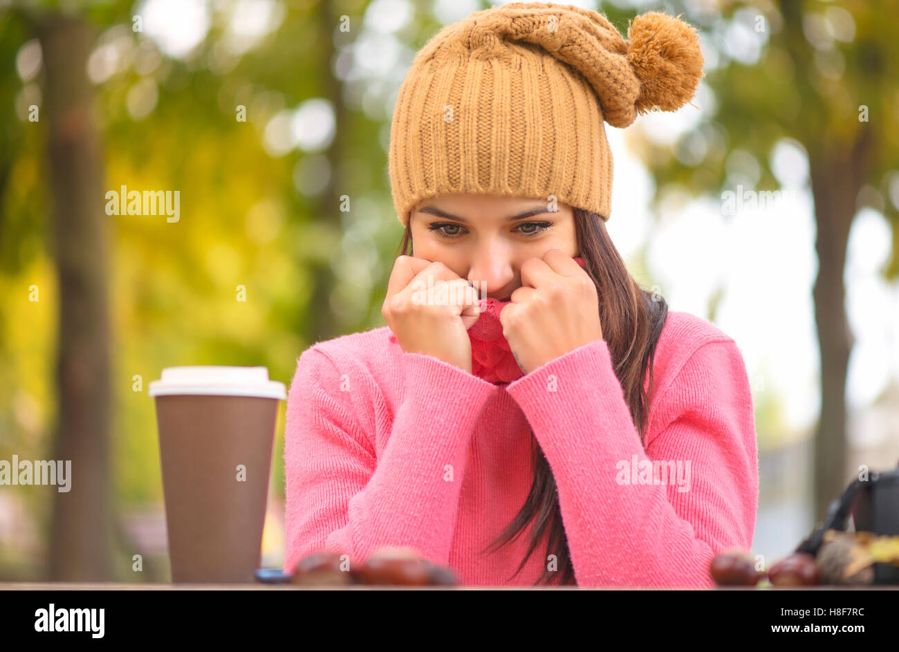 beautiful woman freezing in autumn park, cold autumn Stock Photo - Alamy