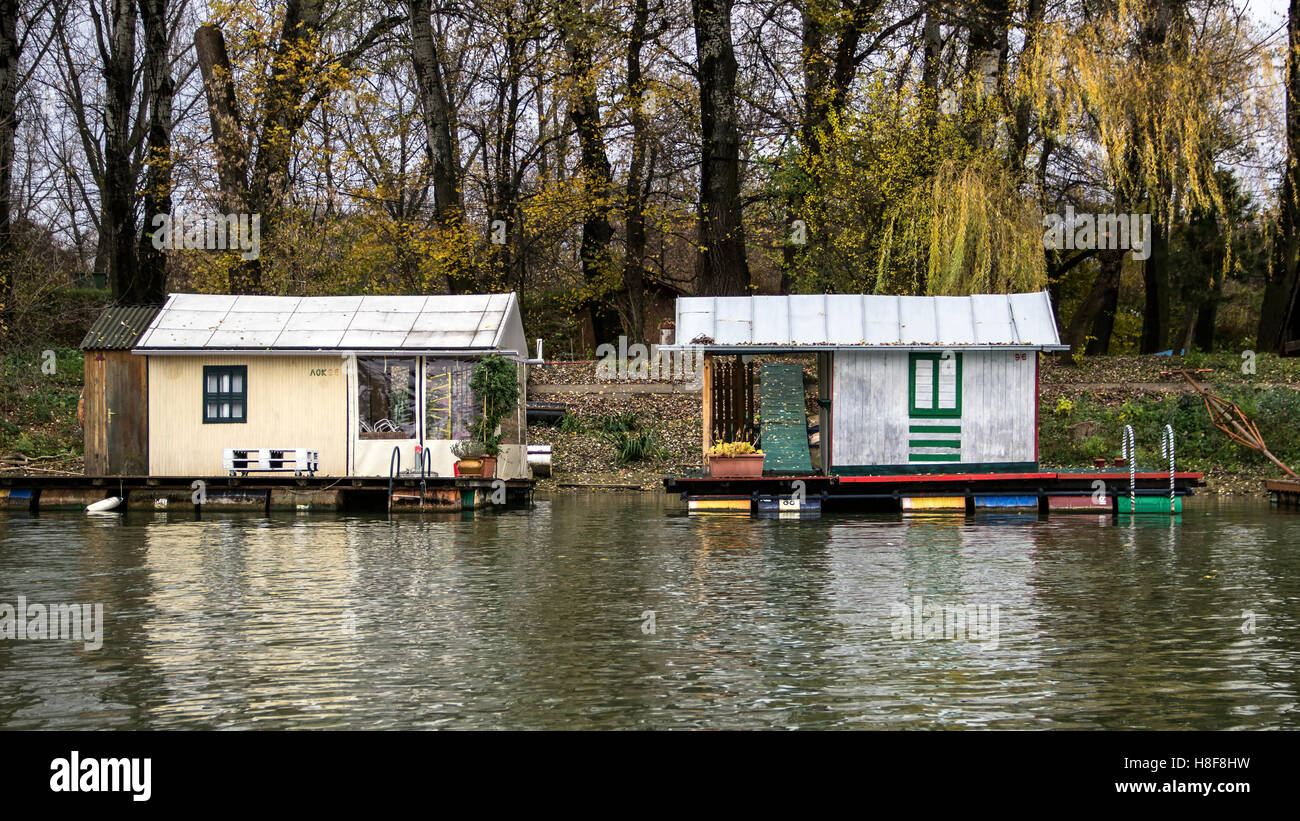 Sava river, Serbia - Two raft houses moored to the shoreline of Ada ...