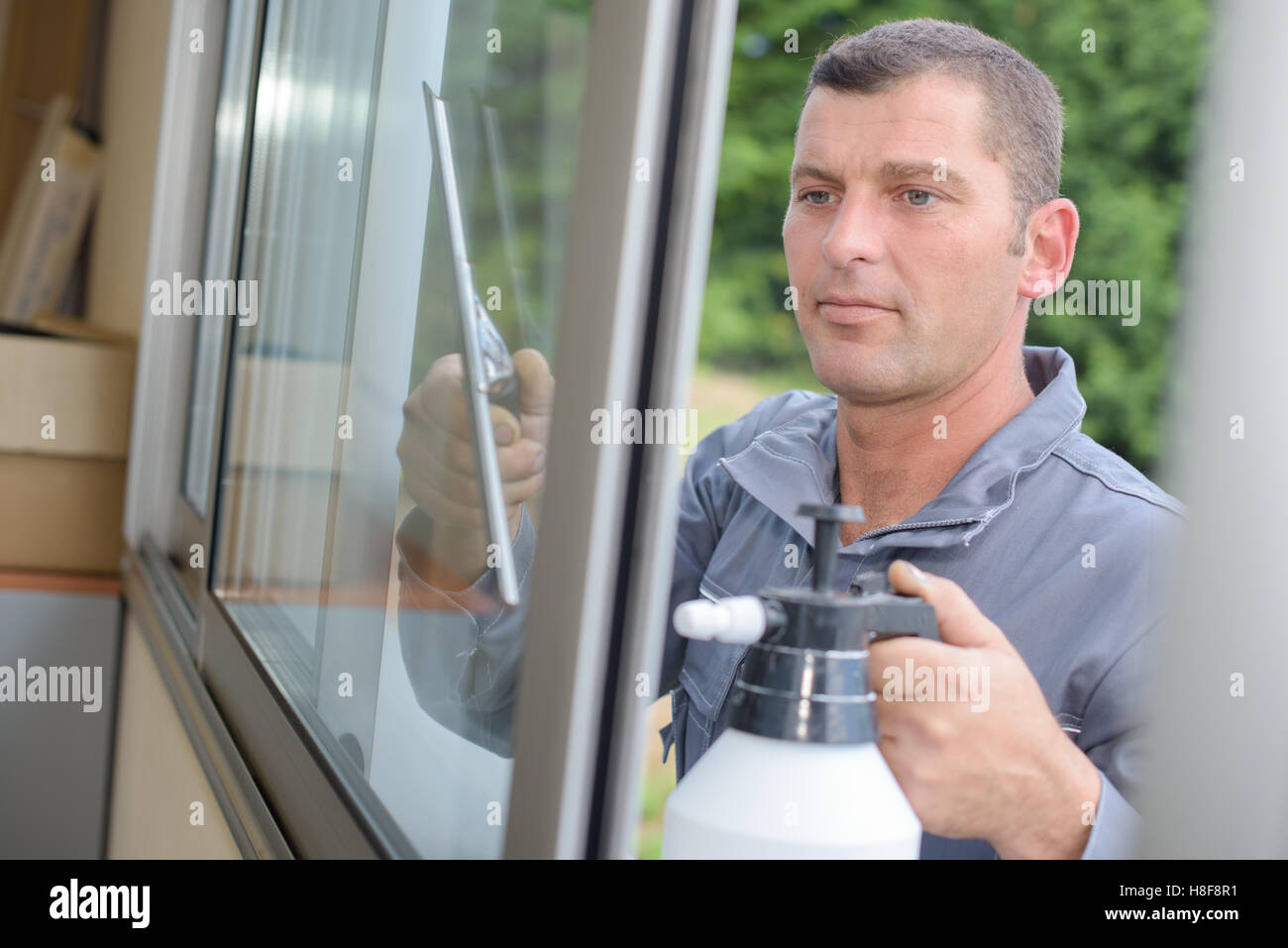 Man cleaning windows Stock Photo - Alamy