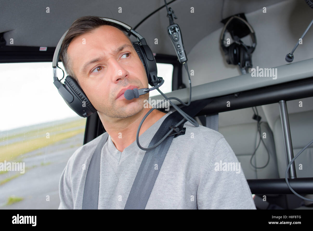 Man in cockpit of aircraft Stock Photo - Alamy