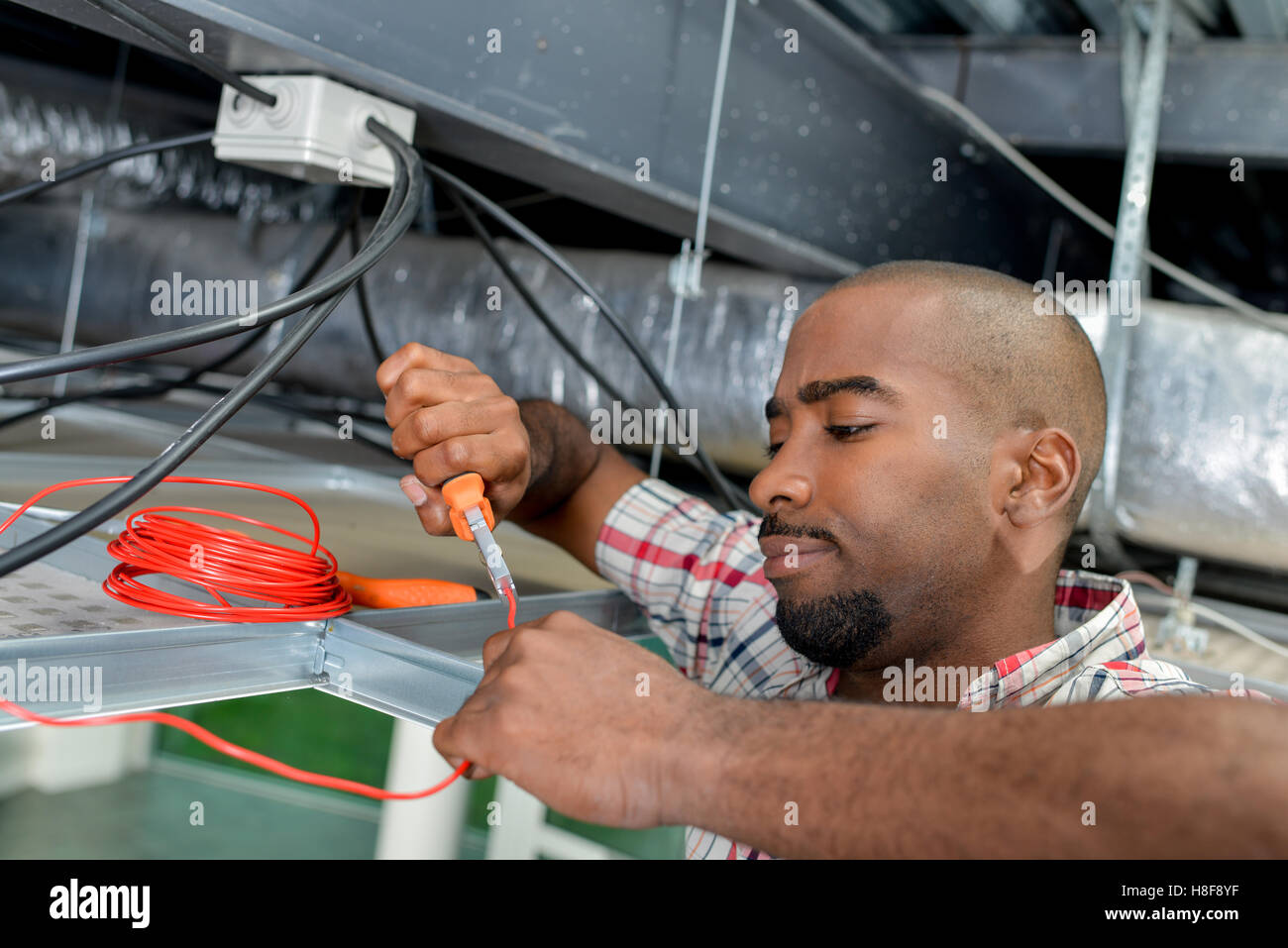 fixing the wirings Stock Photo - Alamy