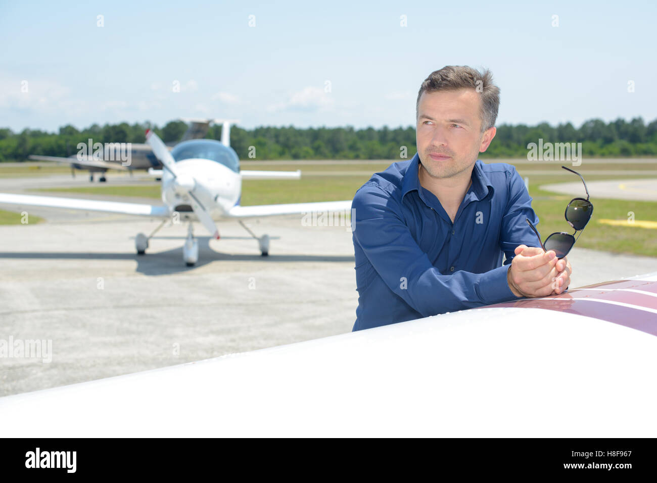 Portrait of man at aerodrome Stock Photo - Alamy