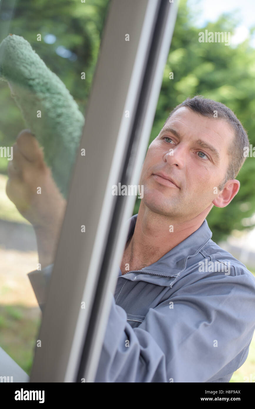 Man cleaning window Stock Photo - Alamy