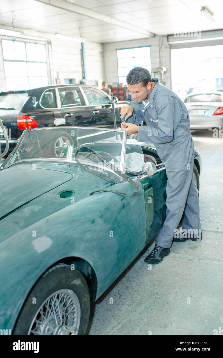 Mechanic repairing a car Stock Photo - Alamy
