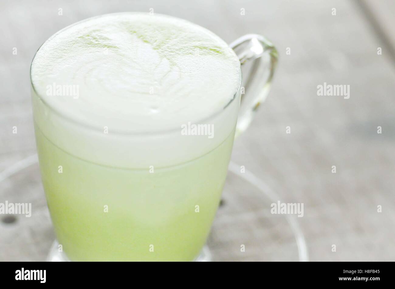 a cup of hot milk green tea Stock Photo - Alamy