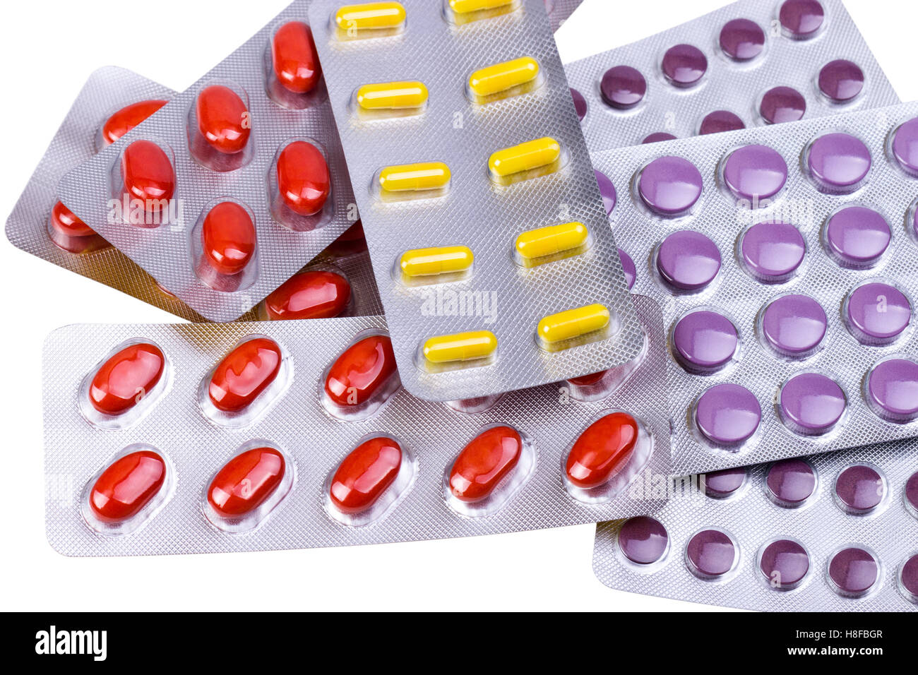 Medicine pills and capsules packed in blisters isolated on white ...