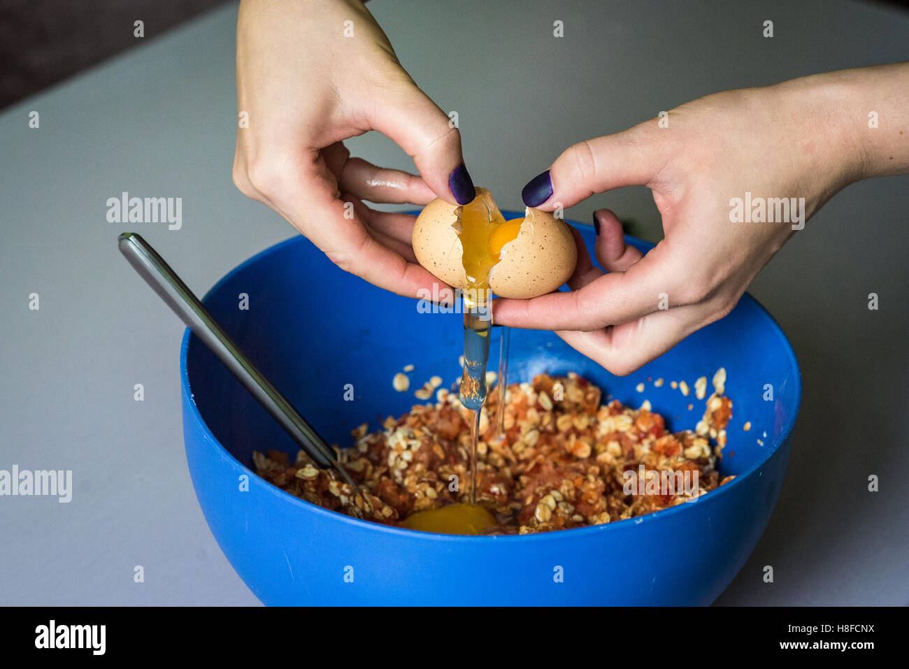 Professional chef pouring raw egg hi-res stock photography and images ...