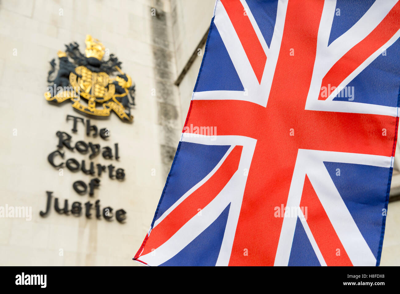 UK Union Jack flag flying in front of The Royal Courts of Justice ...