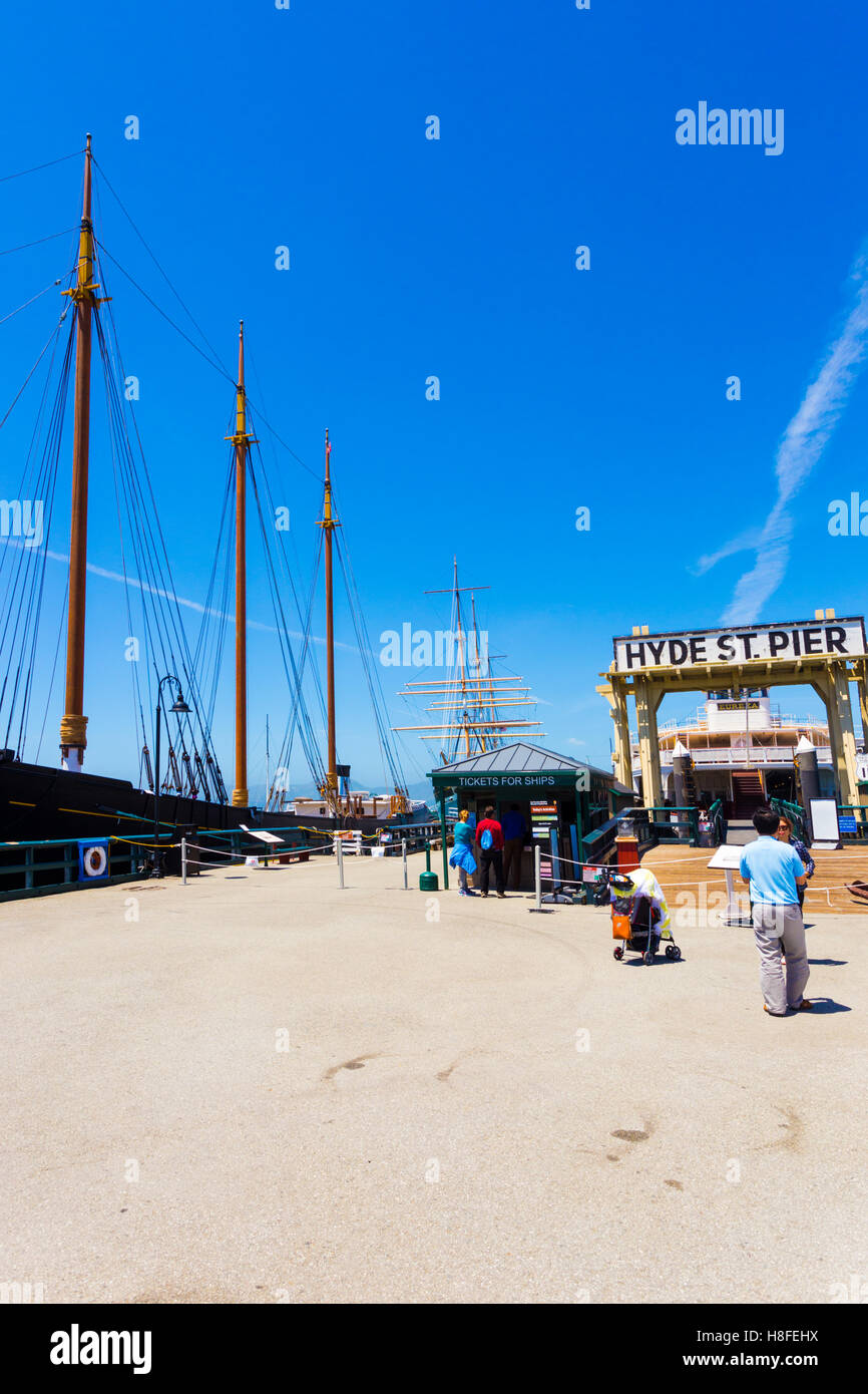 Sunny day under clear, blue sky at the Hyde Street Pier sign with old ...