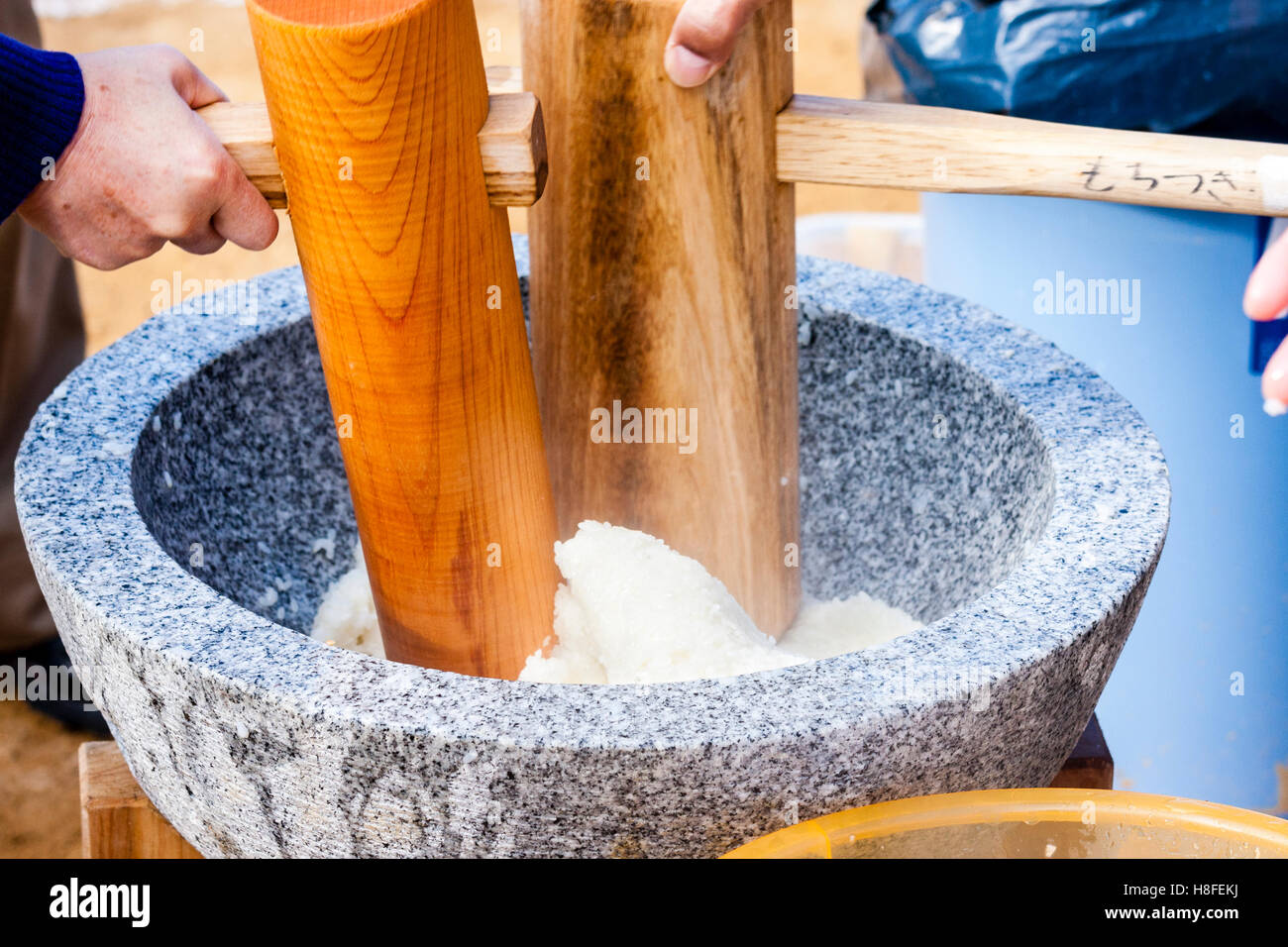 Japan. Omochi, rice bashing festival. Close-up, usu, mortar with rice ...