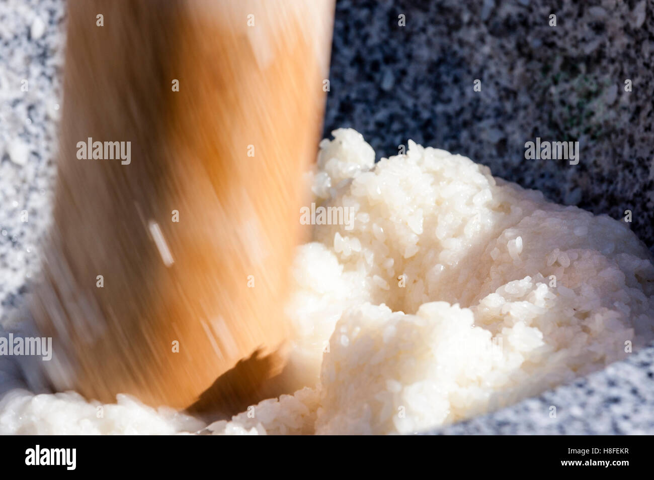 Japan. Omochi, rice bashing festival. Close-up, usu, mortar with rice ...