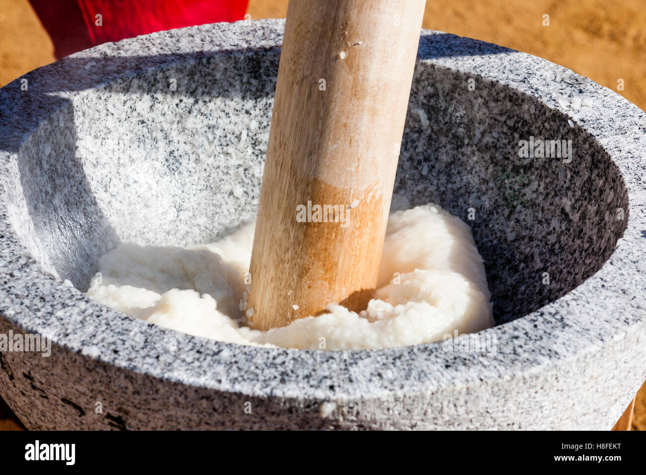 Japan. Omochi, rice bashing festival. Close-up, usu, mortar with rice ...