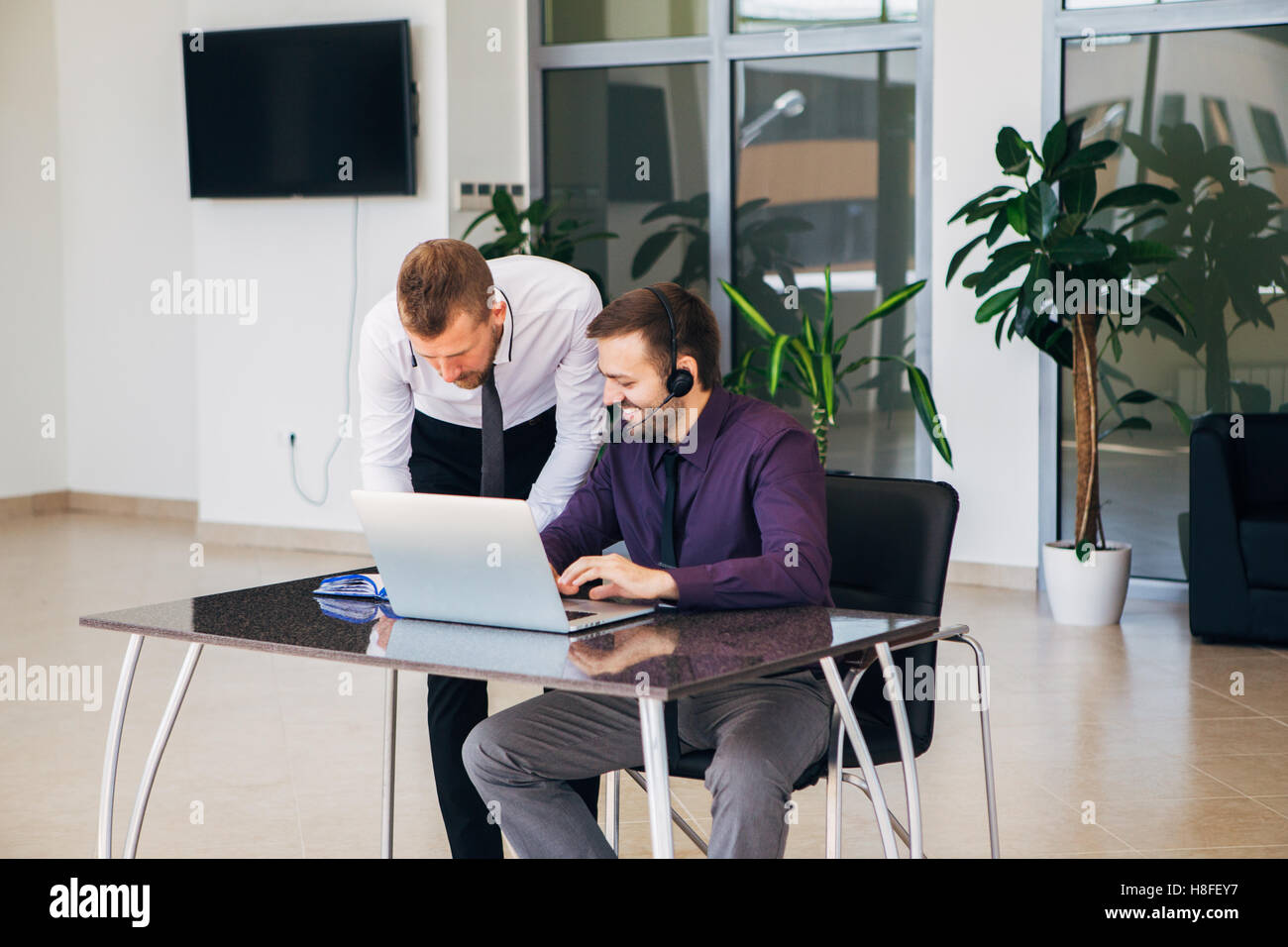 two businessmen in a business meeting discussing graphics Stock Photo ...