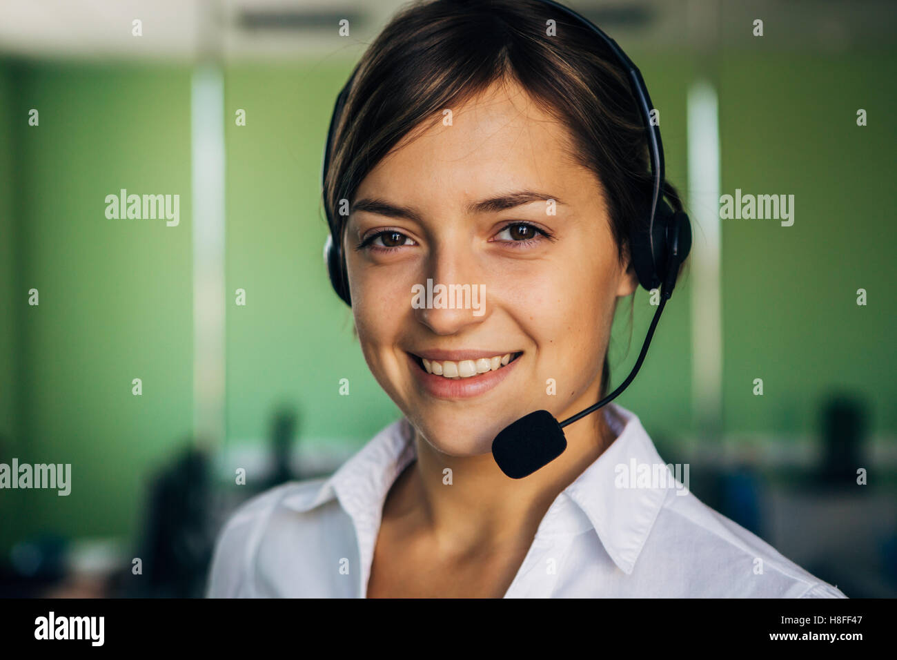 Friendly female customer service representative hi-res stock ...
