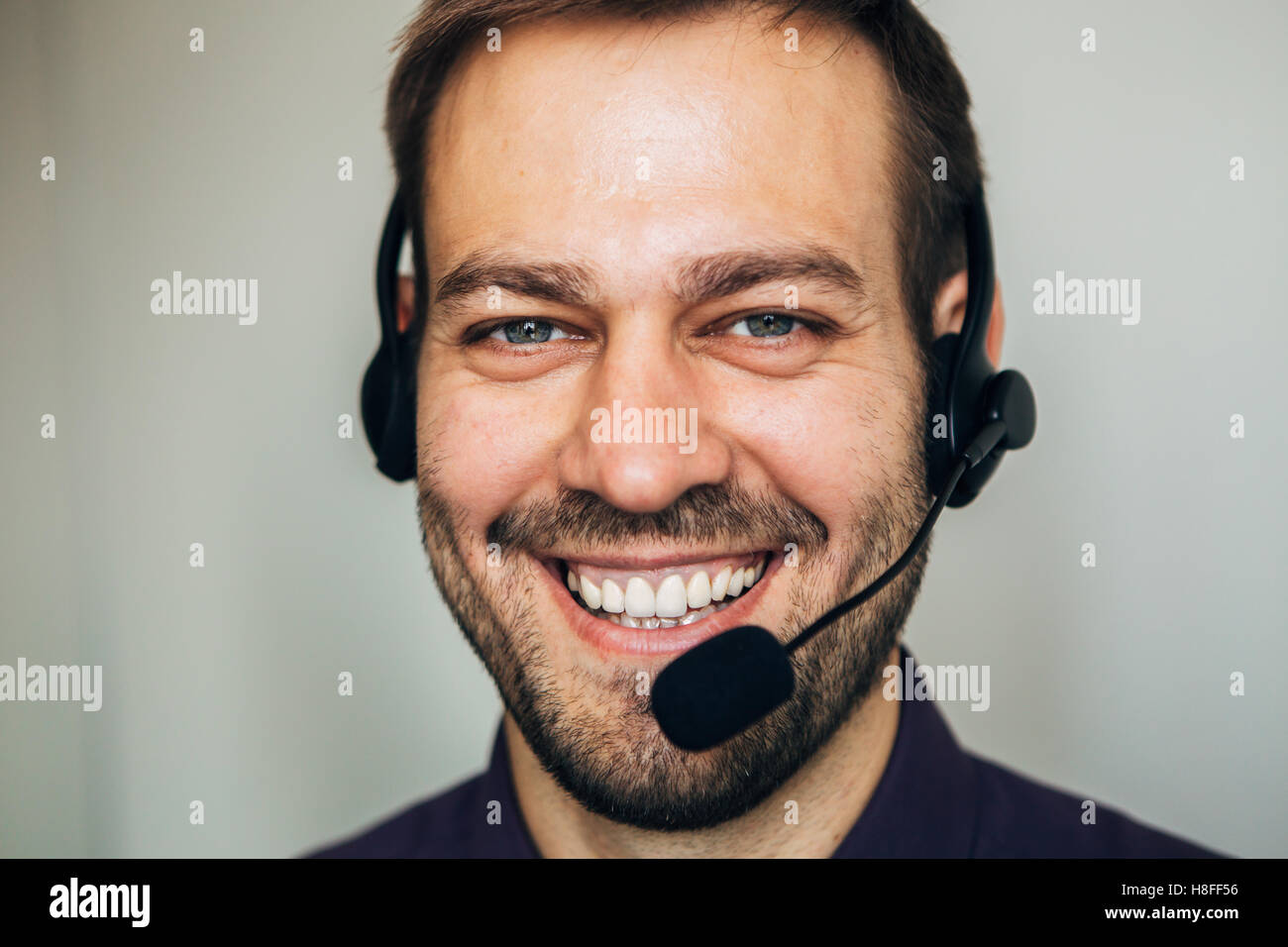 Close up of smiling call center agent helping costumer Stock Photo - Alamy