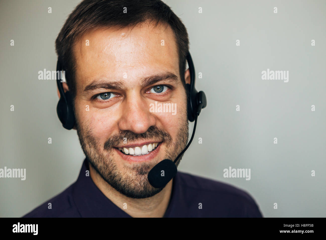 Close up of smiling call center agent helping costumer Stock Photo - Alamy
