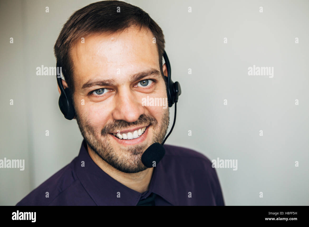 Close up of smiling call center agent helping costumer Stock Photo - Alamy