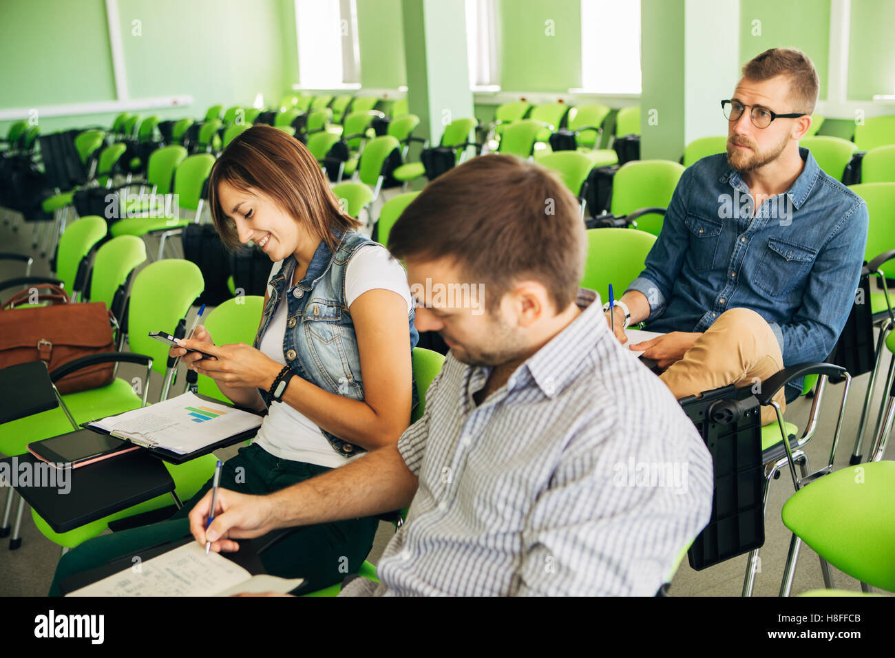 students listen to teachers lecture and ask questions Stock Photo - Alamy