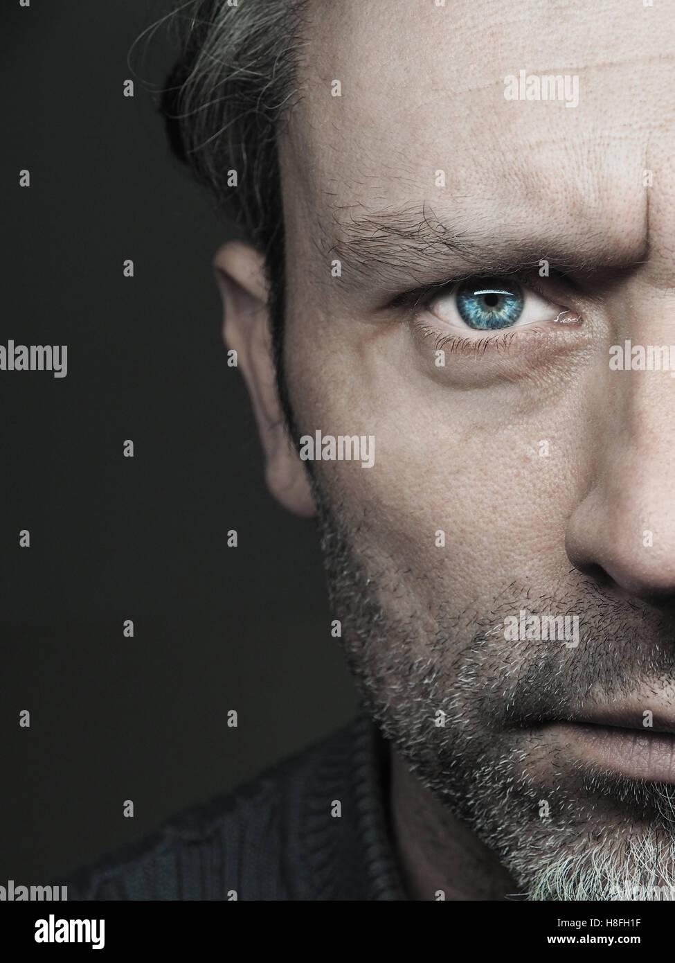 Man face on dark looking up close up hi-res stock photography and ...