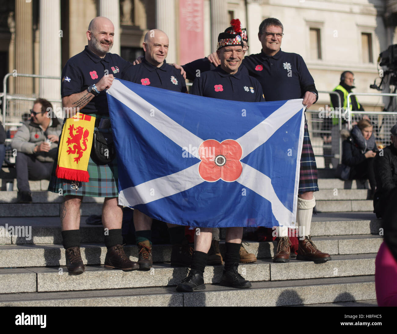Scottish football fans hold a Saltire flag during an event in London's ...