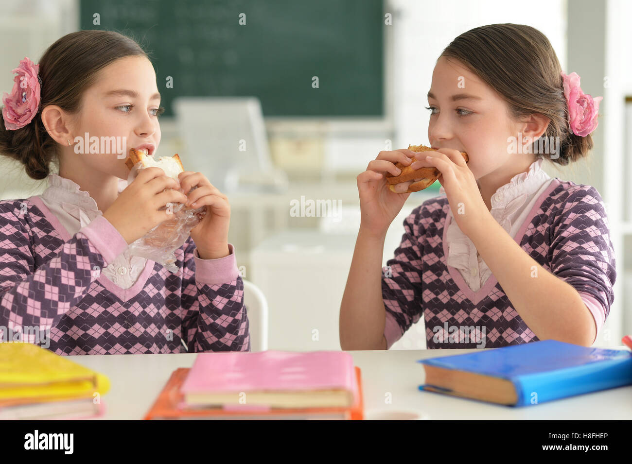 Girls eat sandwiches Stock Photo - Alamy