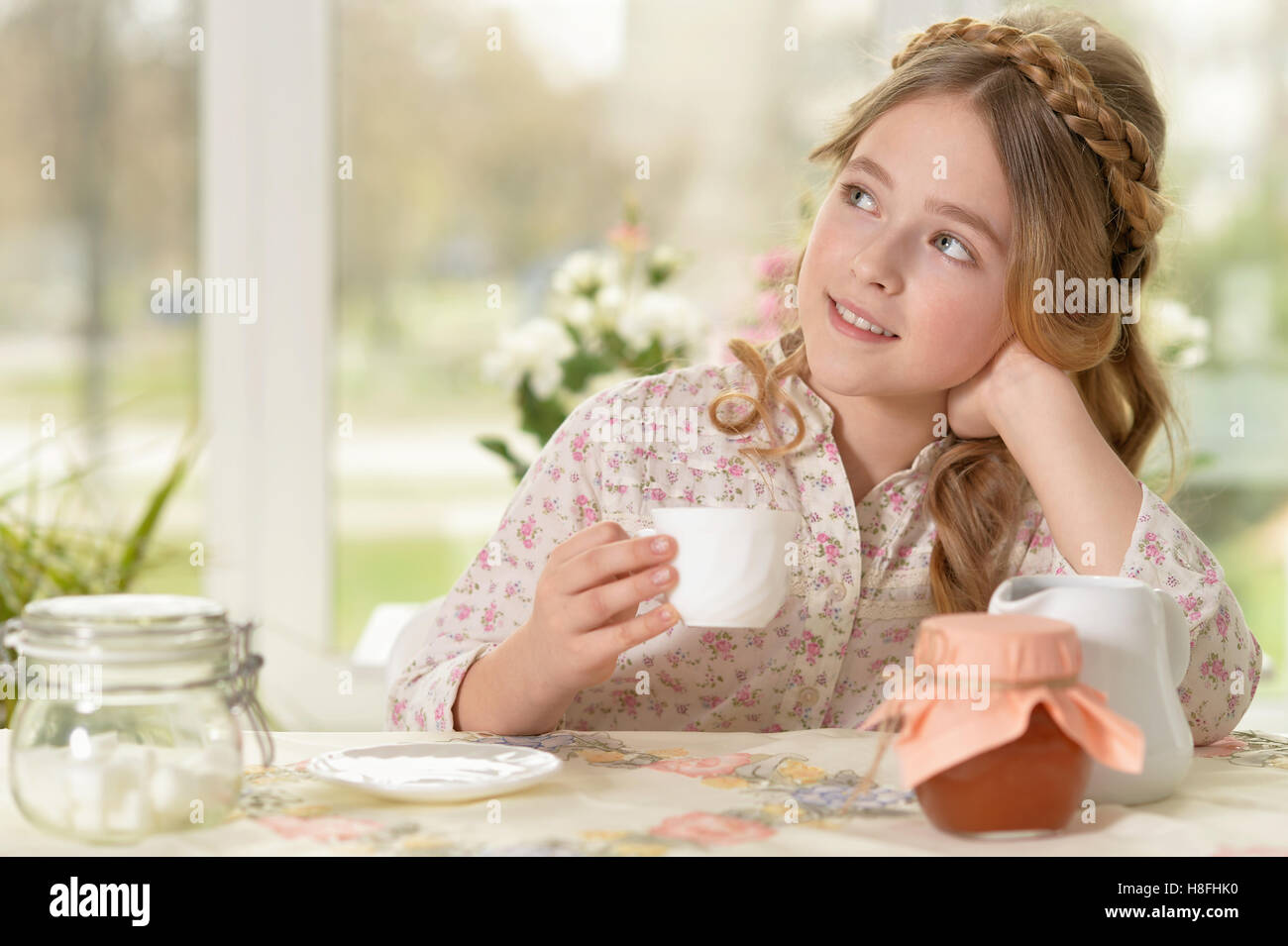 little girl drinking tea Stock Photo - Alamy
