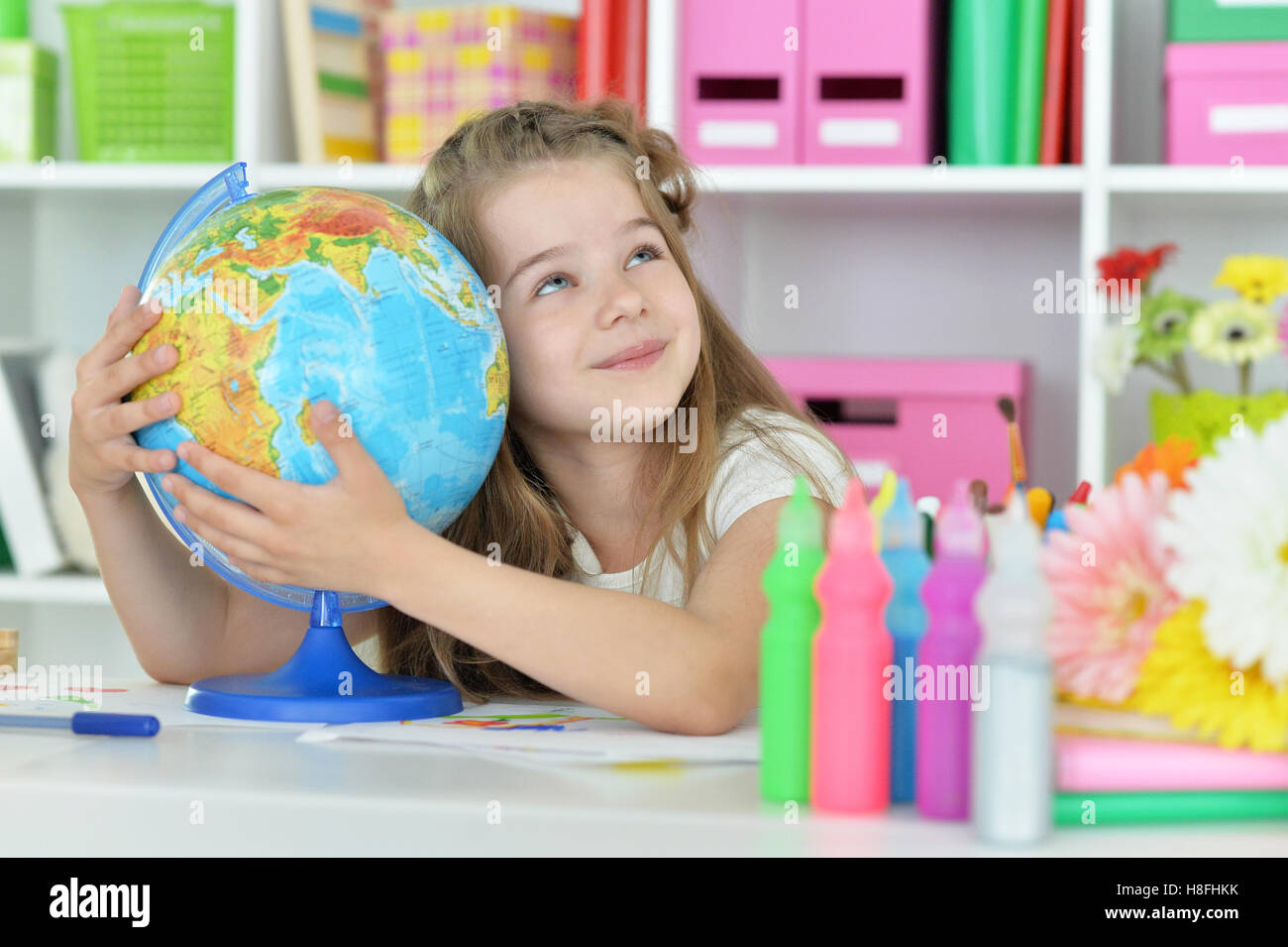 Little girl drawing at class Stock Photo - Alamy