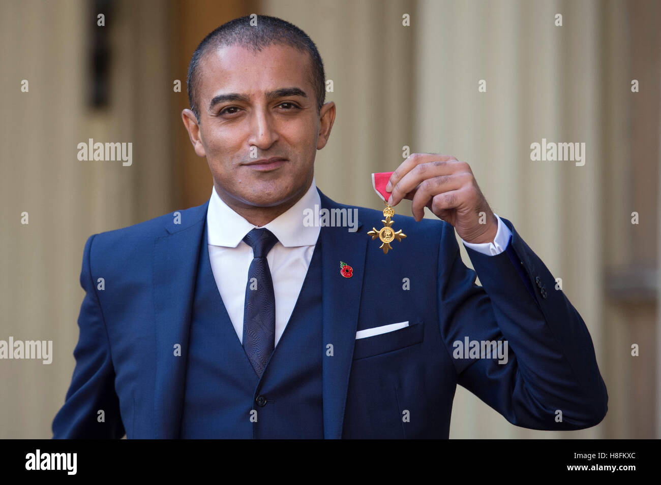 Actor and writer Adil Ray with his OBE which he received from the Duke ...