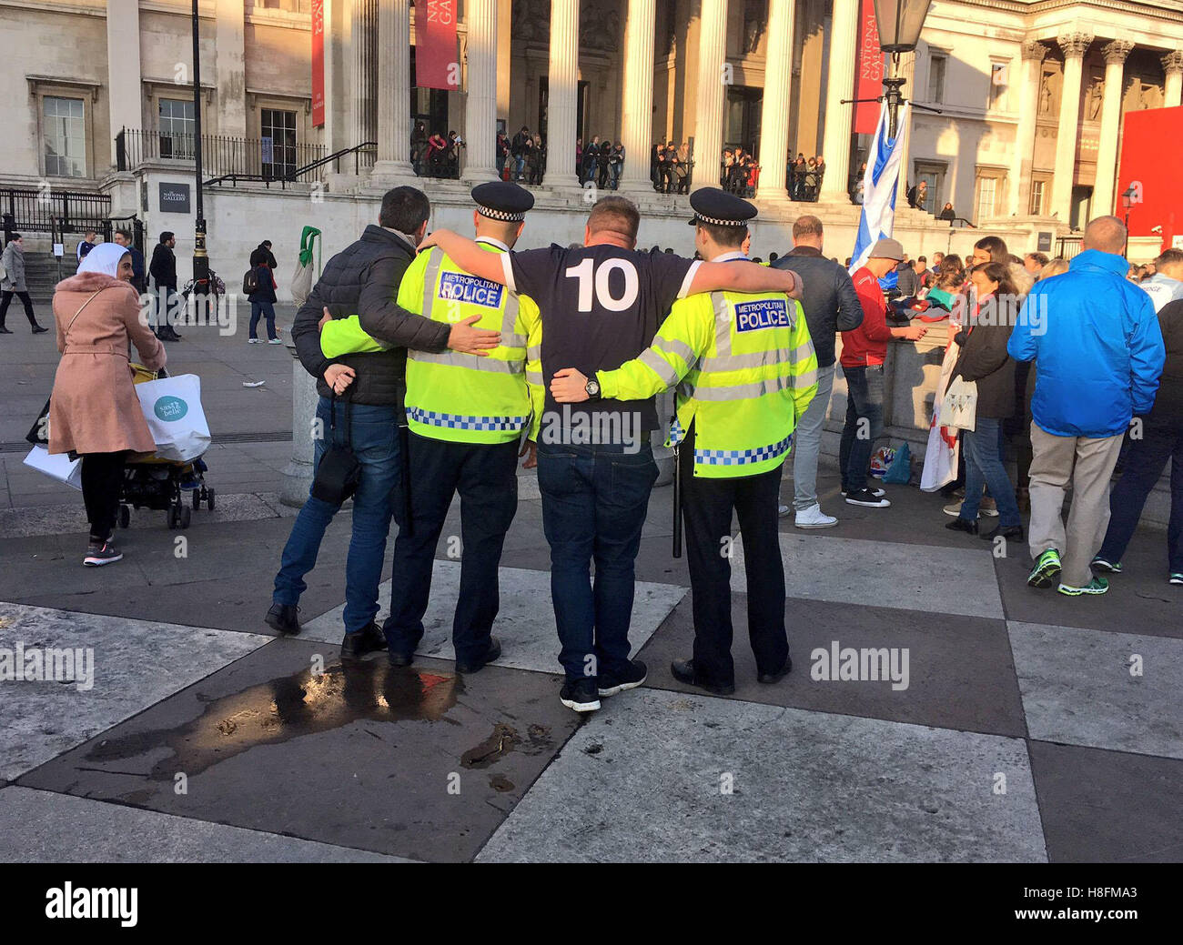 Scotland fans and police officers in Trafalgar Square, London, as ...