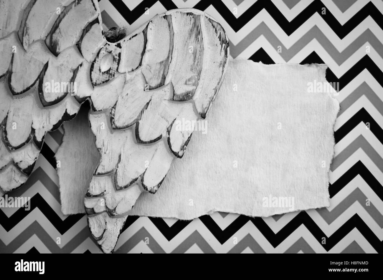 white wooden wings decoration against black and white pattern Stock ...