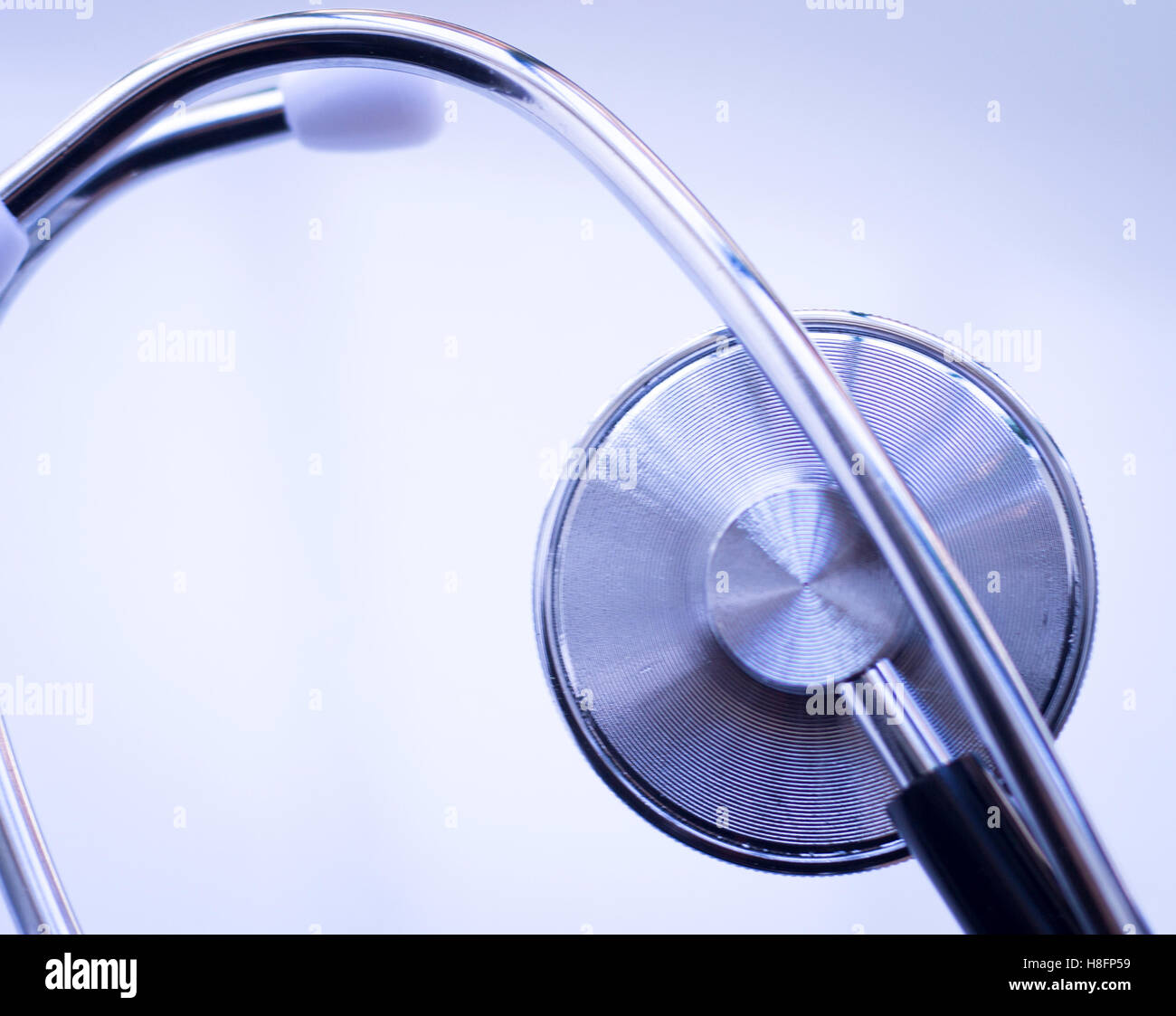 Medical doctor's stethoscope used to listen to patient heart rate ...