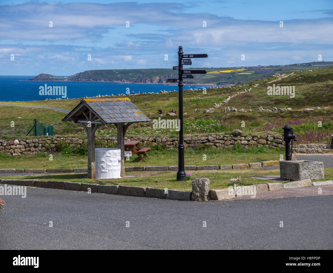 Wishing well and tourist sign near the cliffs in Cornwall Stock Photo ...
