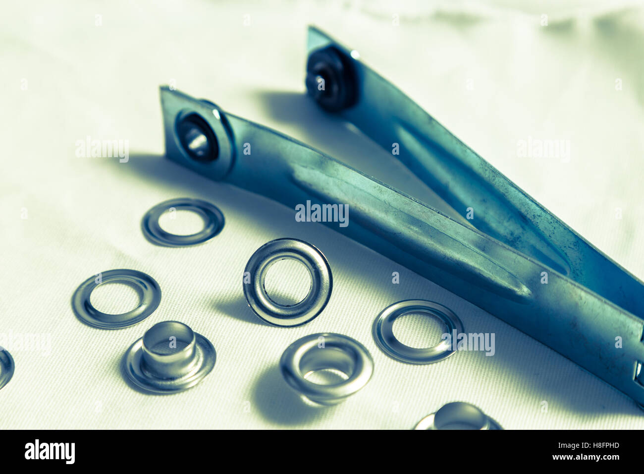 Hole rivets on canvas retro optic Stock Photo - Alamy