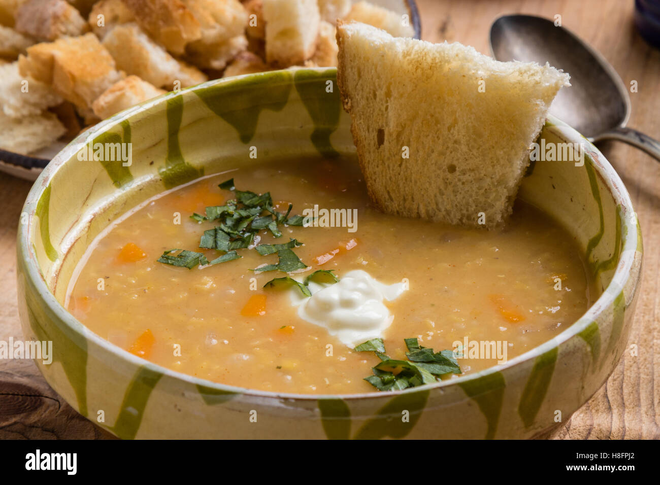 red lentil soup in bowl on rustic table setting Stock Photo - Alamy