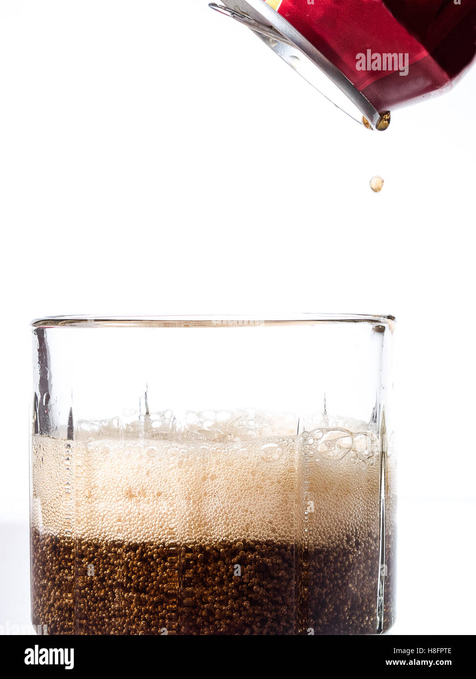 Pouring Cola from a can into a glass Stock Photo - Alamy