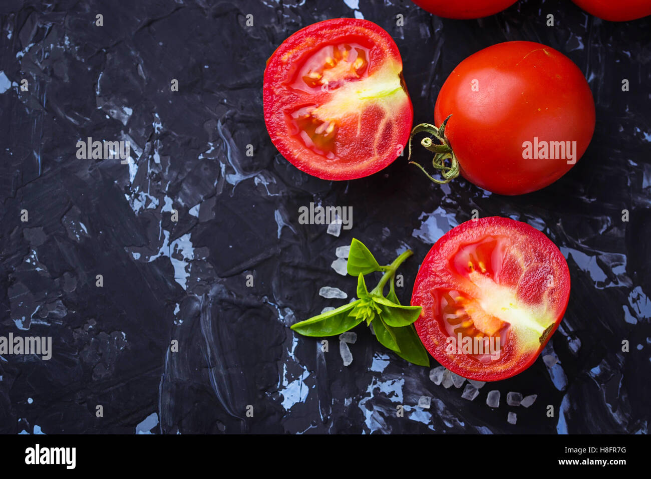Ripe tomato, basil and olive oil. Selective focus Stock Photo - Alamy