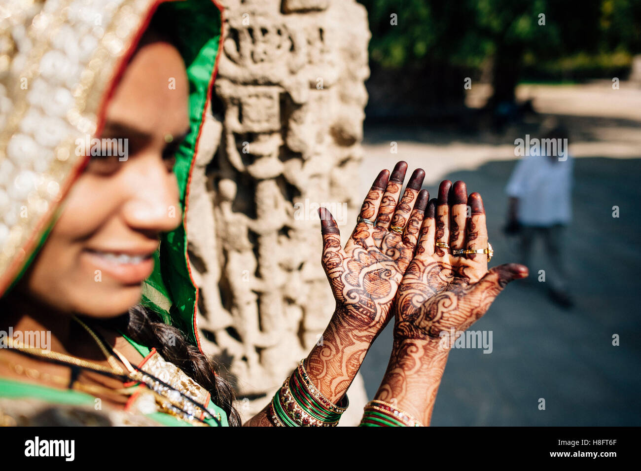 A woman shows us her henna painting at the solar temple in Modhera ...