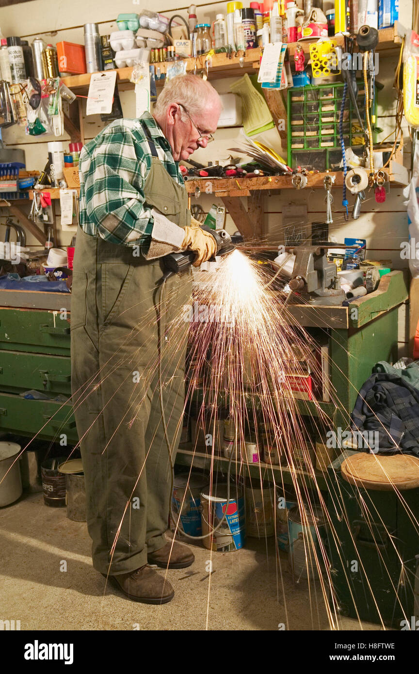 Man working at his work bench Stock Photo - Alamy