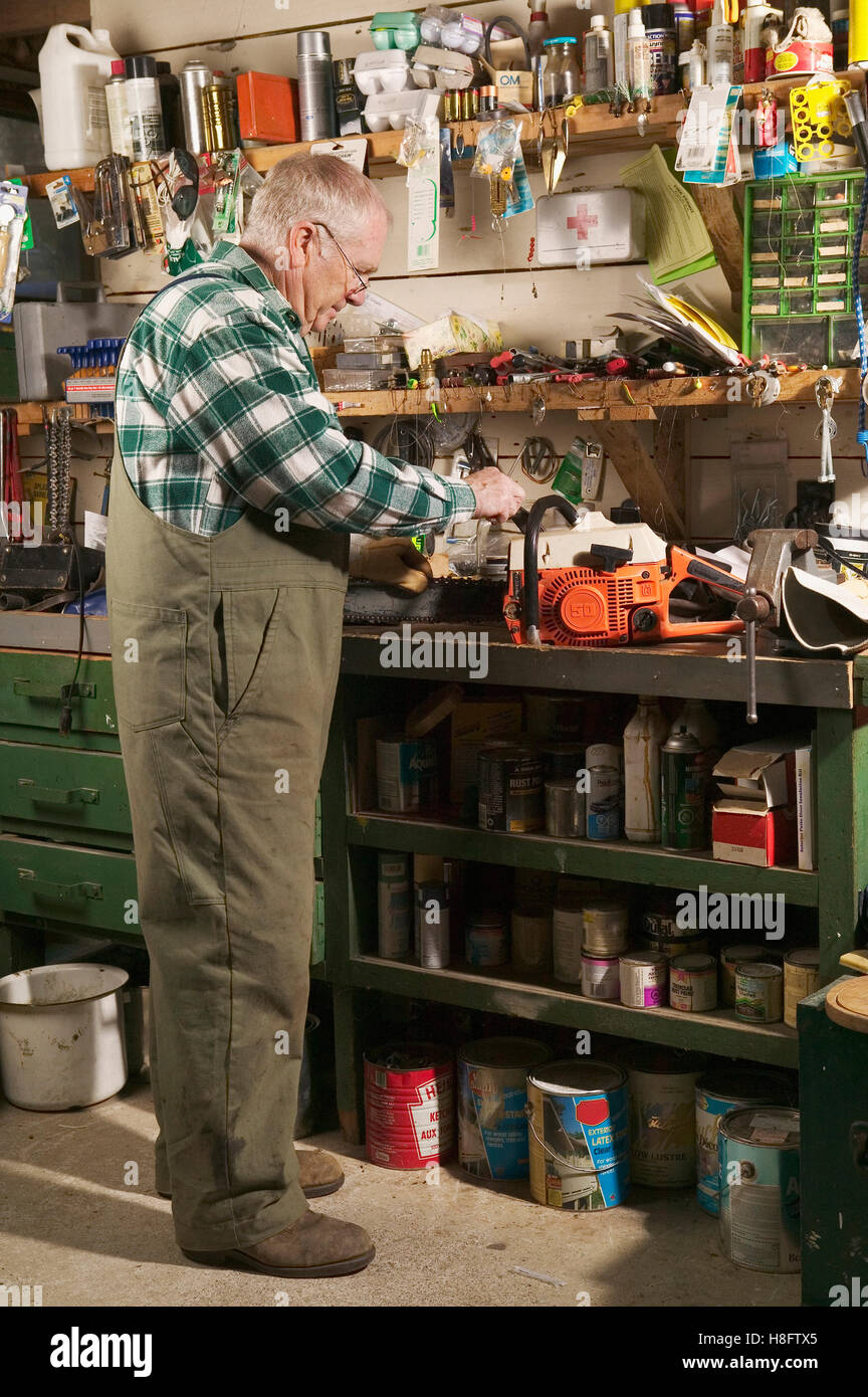 Man working at his work bench Stock Photo - Alamy