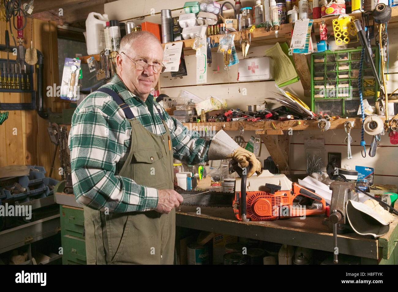 Man working at his work bench Stock Photo - Alamy