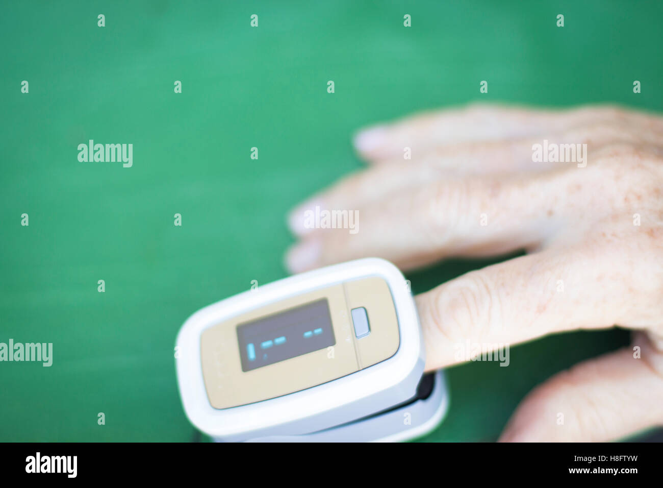 Portable hand held domestic cardiac finger pulse rate meter to show ...