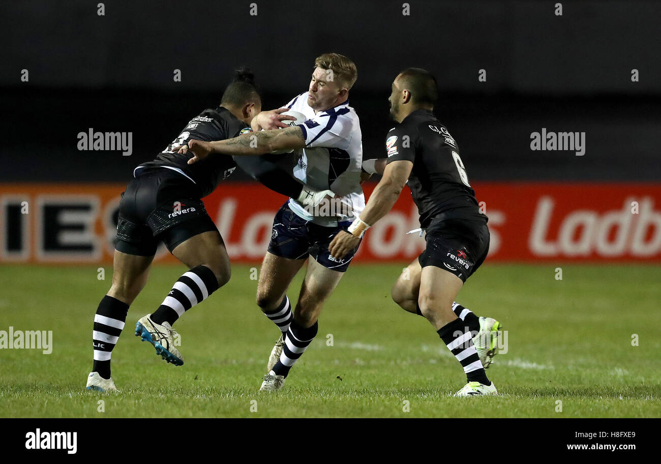 Scotland's Ben Hellewell is tackled by New Zealand's Solomone Kata ...