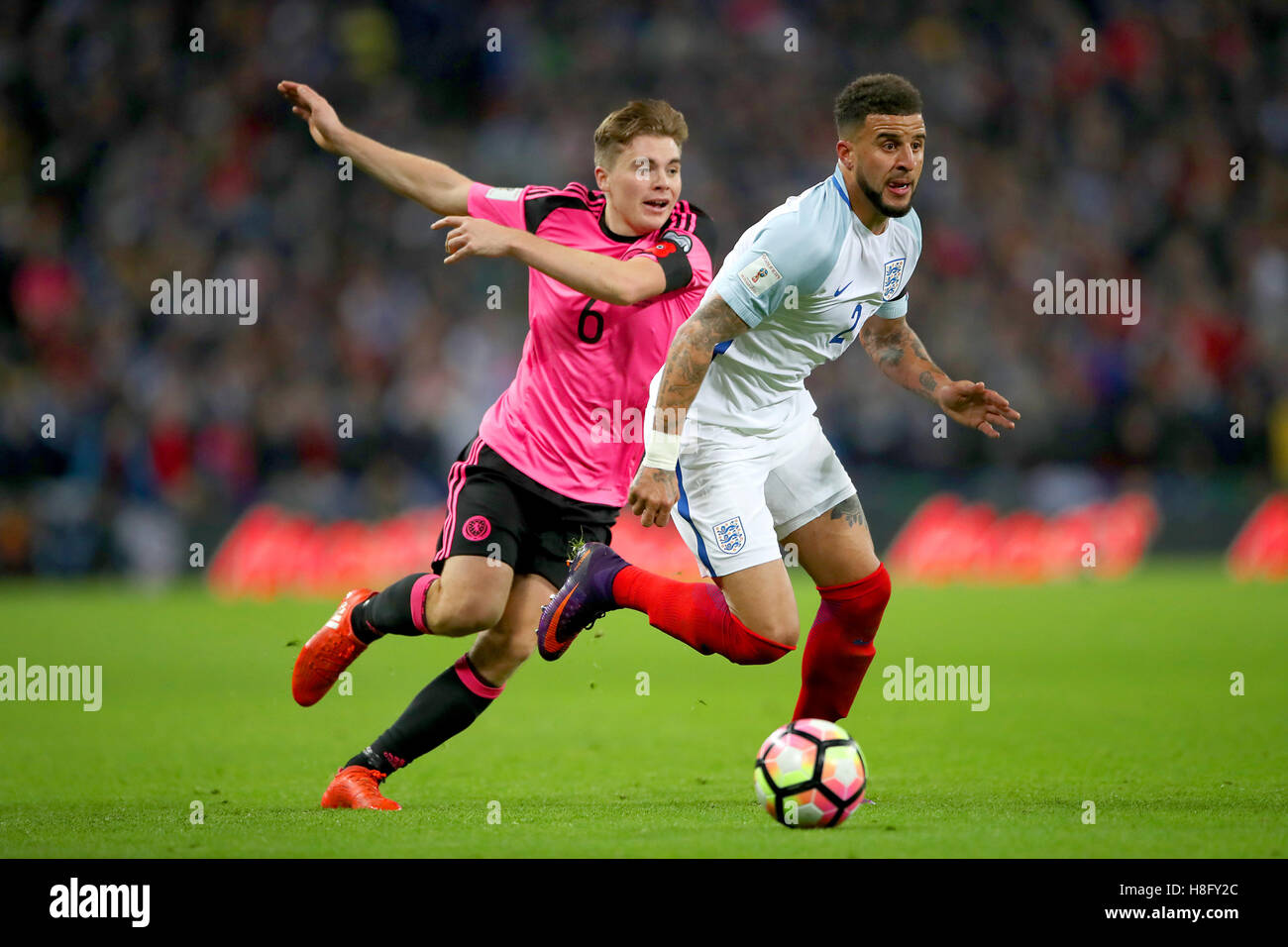 Scotland's James Forrest (left) and England's Kyle Walker battle for ...