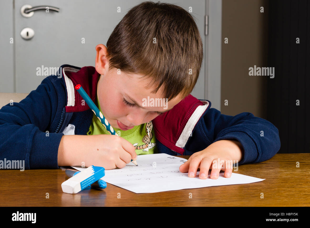 Child portrait write homework hi-res stock photography and images - Alamy