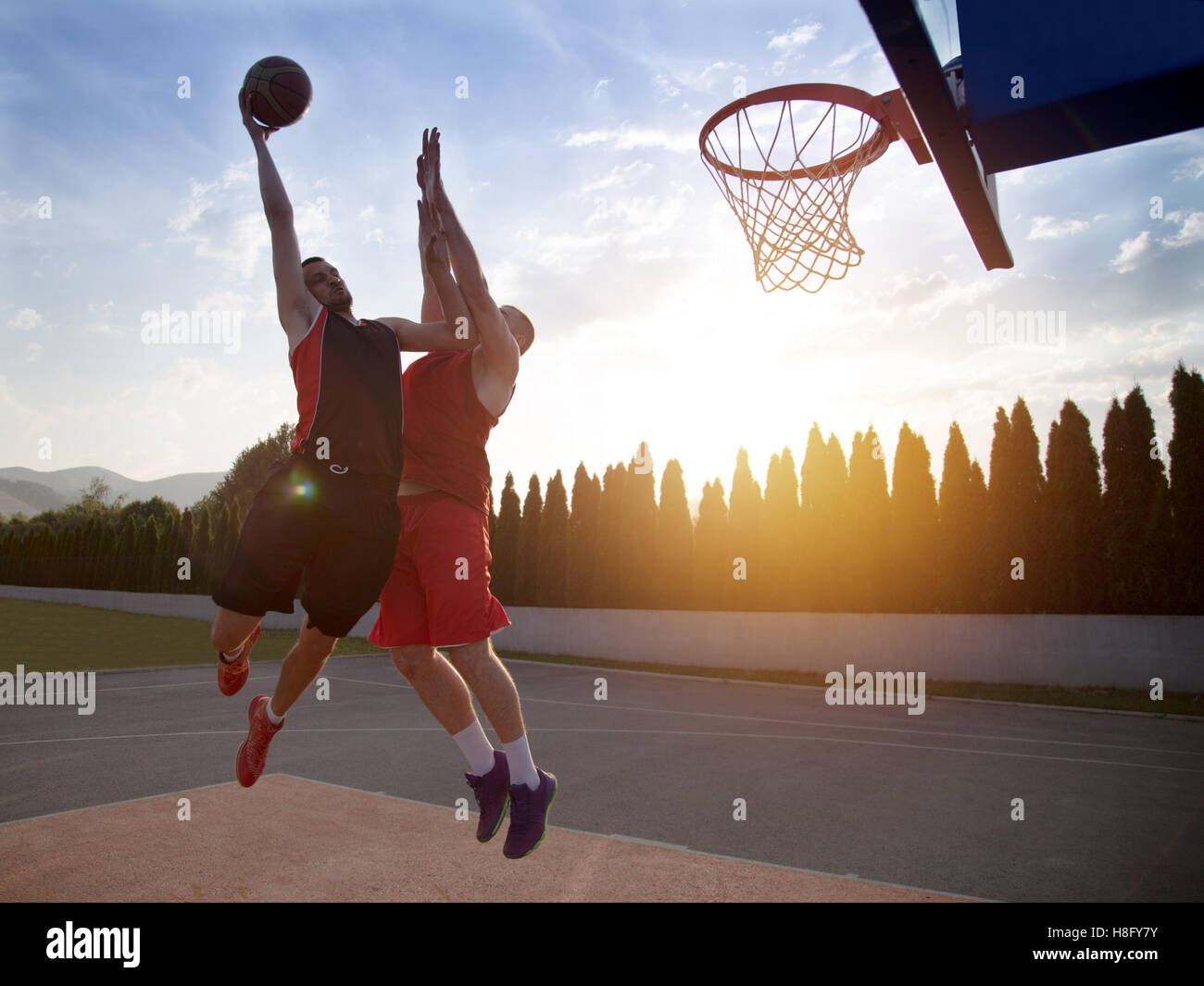 Two basketball players on the court outdoor Stock Photo - Alamy