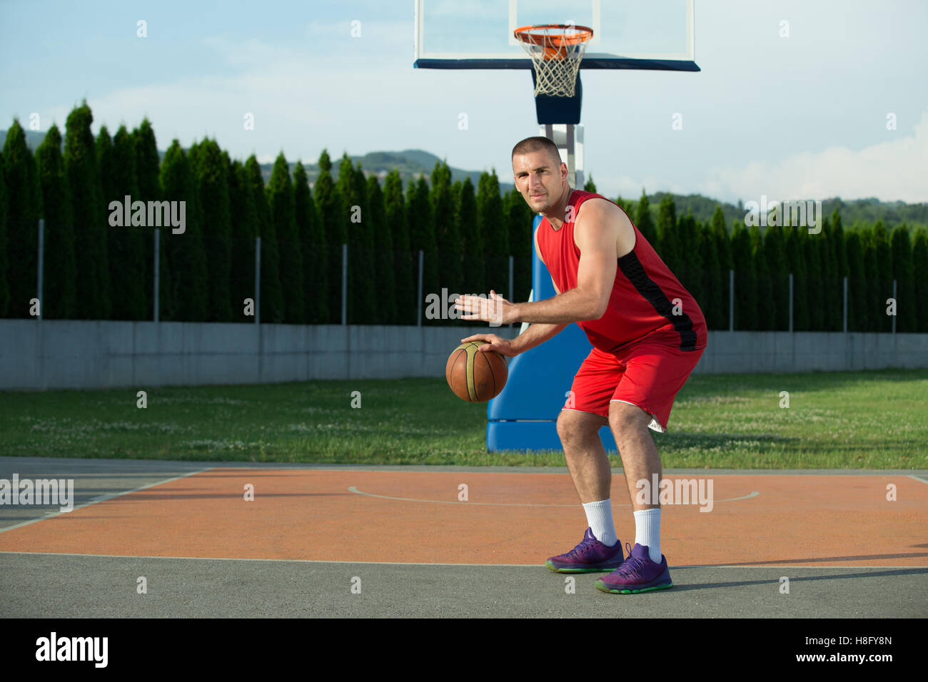 Portrait of young man street basket player Stock Photo - Alamy