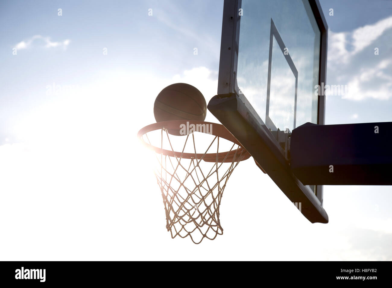 Basketball going through net hi-res stock photography and images - Alamy
