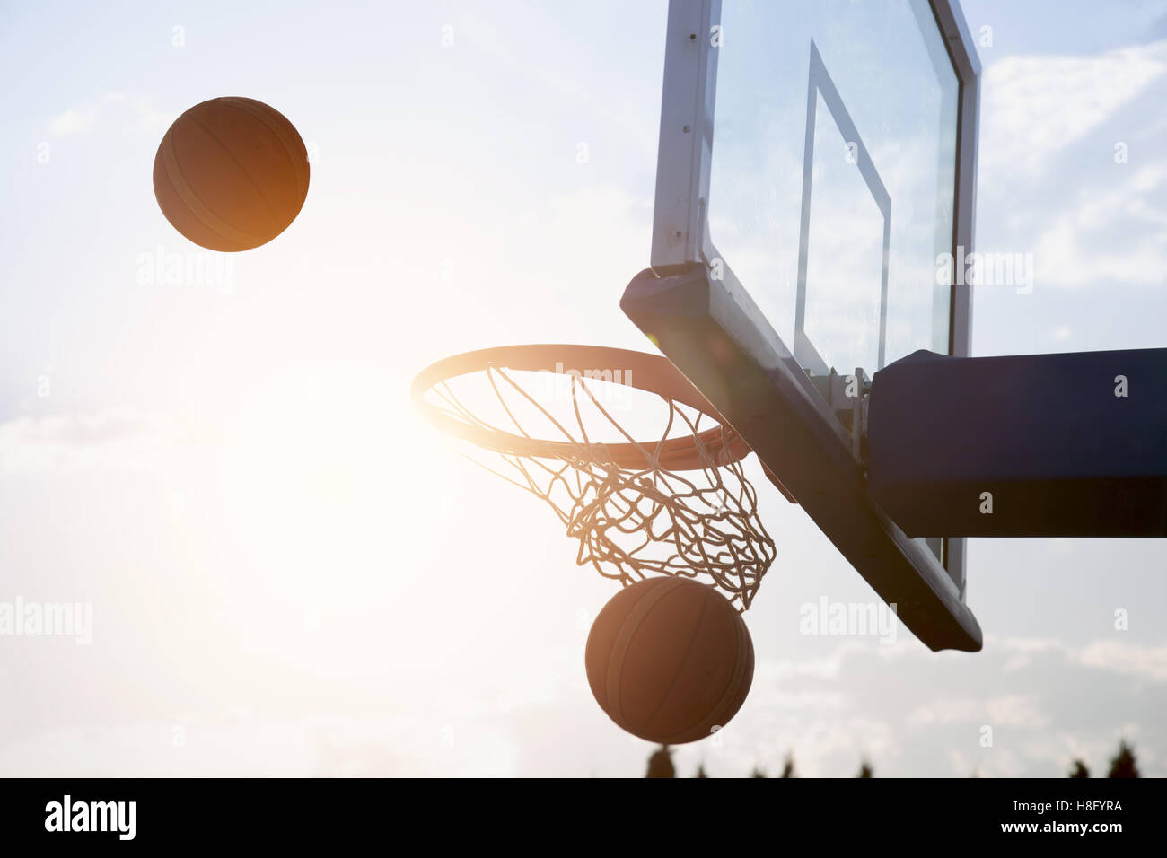 Basketball going through the basket Stock Photo - Alamy