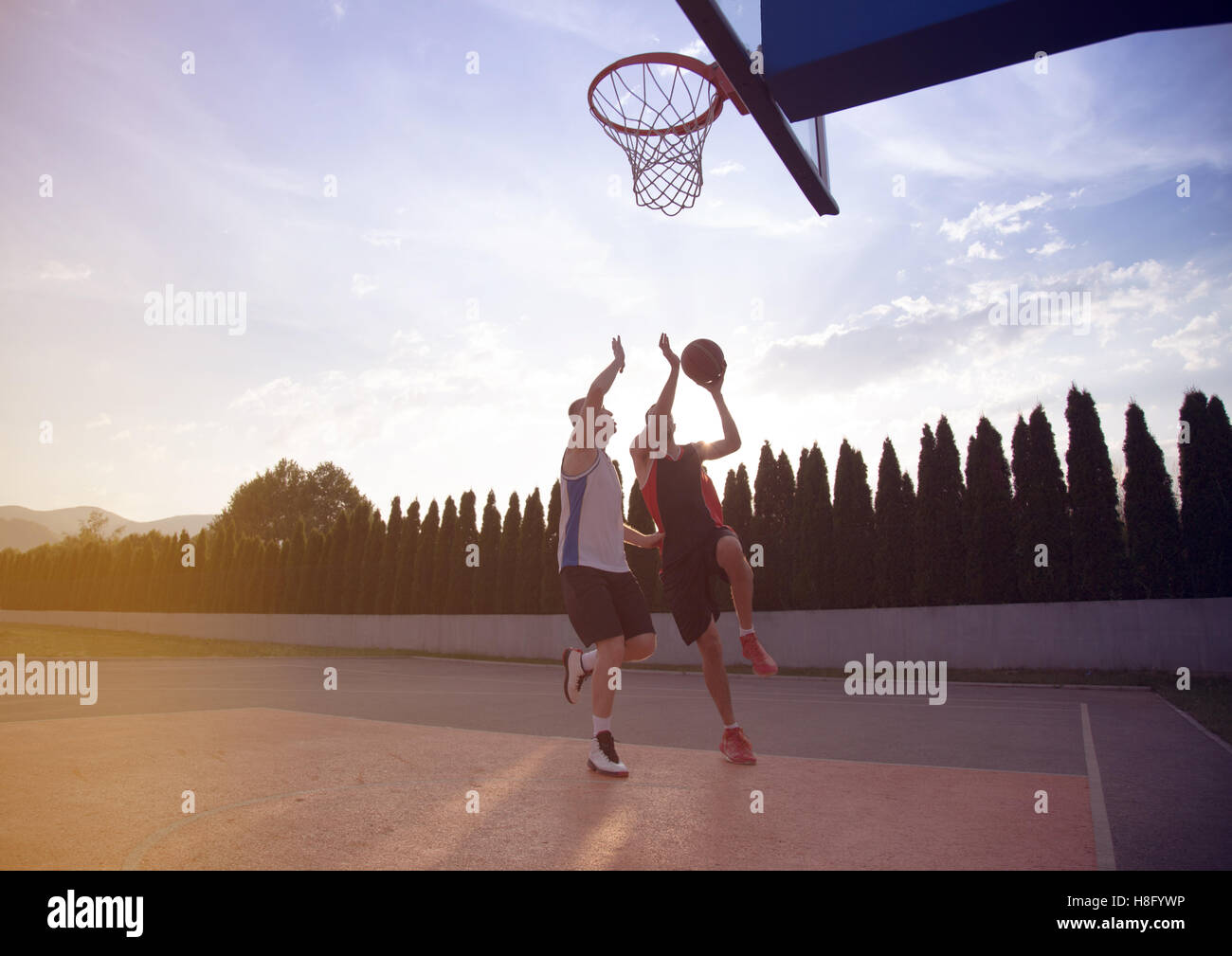 Two basketball players on the court outdoor Stock Photo - Alamy
